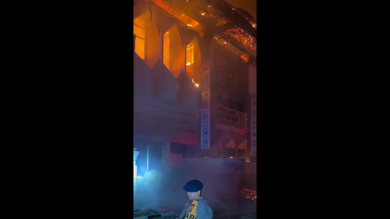 Fire crews battle blaze engulfing government building in Indonesia
