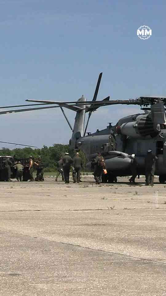 Marines open fire from a flying CH-53E