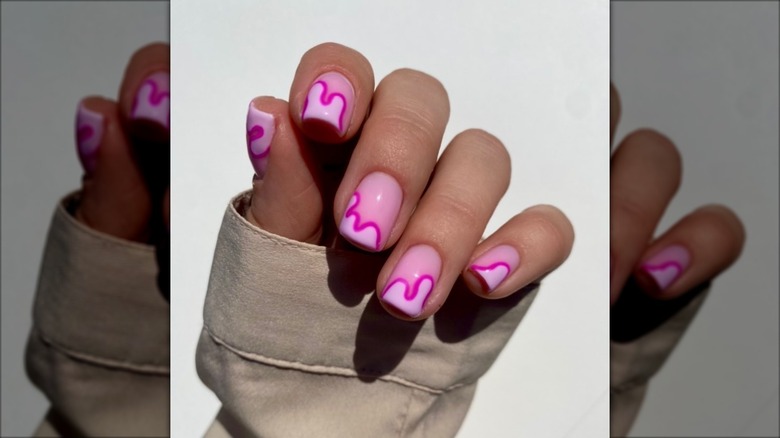 Pink swirl nail designs to give you a Barbielicious look this summer