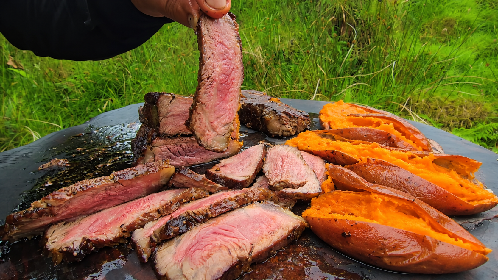 Watch how this sirloin steak turns juicy beside baked potatoes