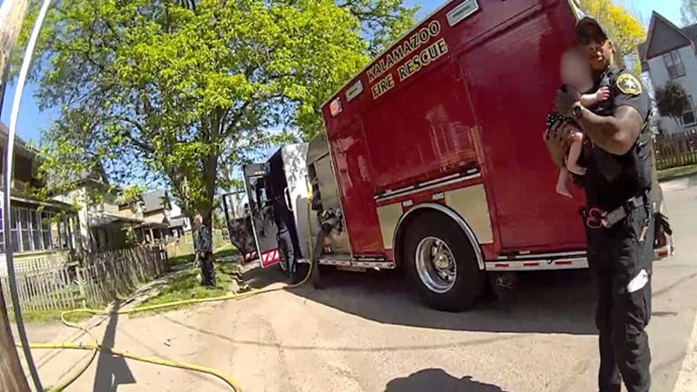 Nice catch: Public safety officer snags infant dropped from burning ...