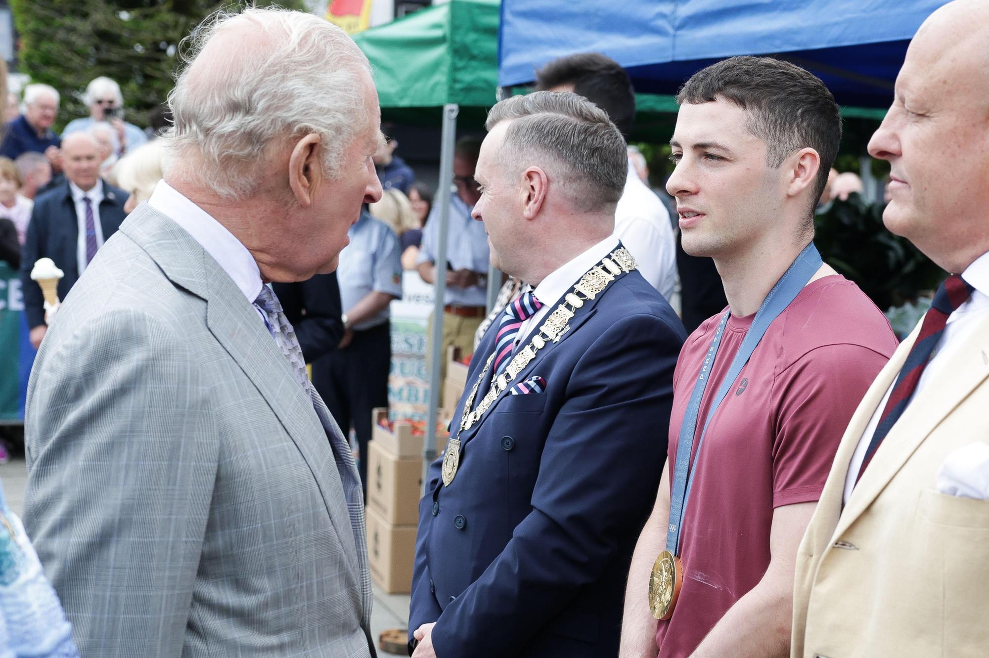 Golden crown meets gold medal: King Charles greets Olympic hero Rhys ...
