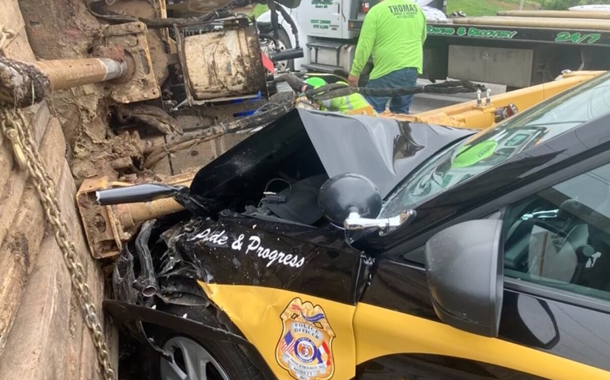 Monett, Mo., police cruiser collides with trailer hauling heavy machinery