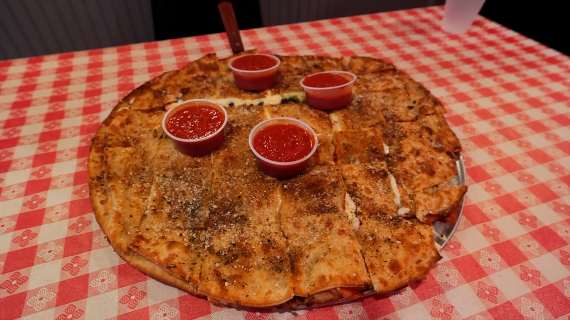 She attempts double-stacked 18-inch pizza challenge - solo