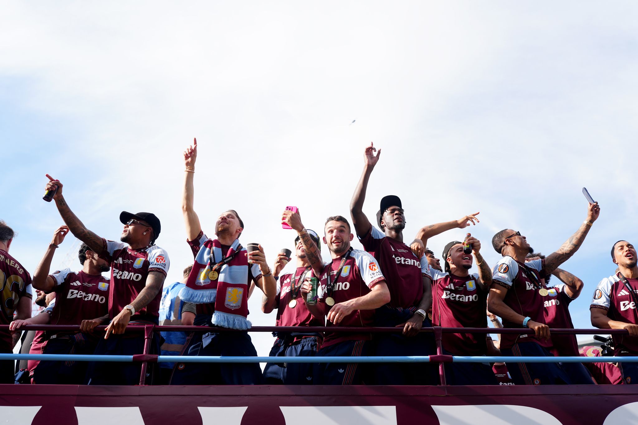 Fans line streets to greet Aston Villa after Europa League success