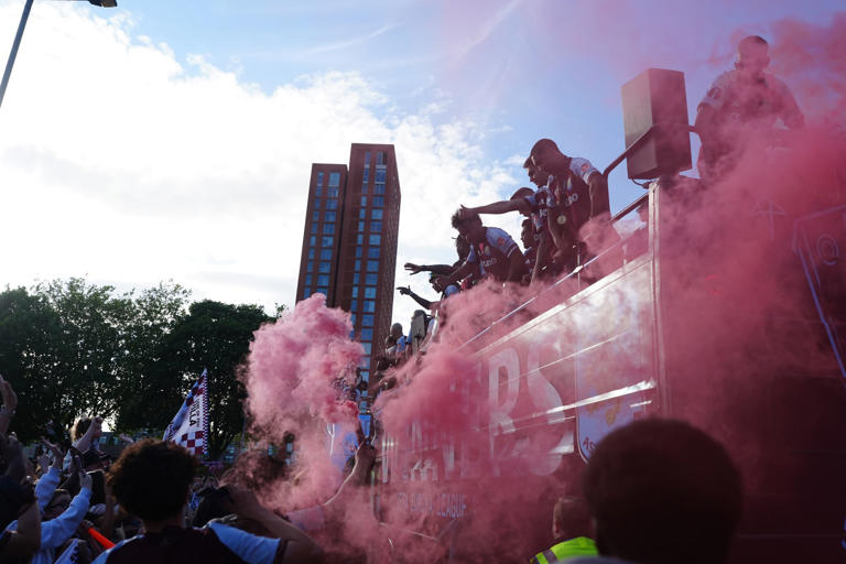 Fans line streets to greet Aston Villa after Europa League success