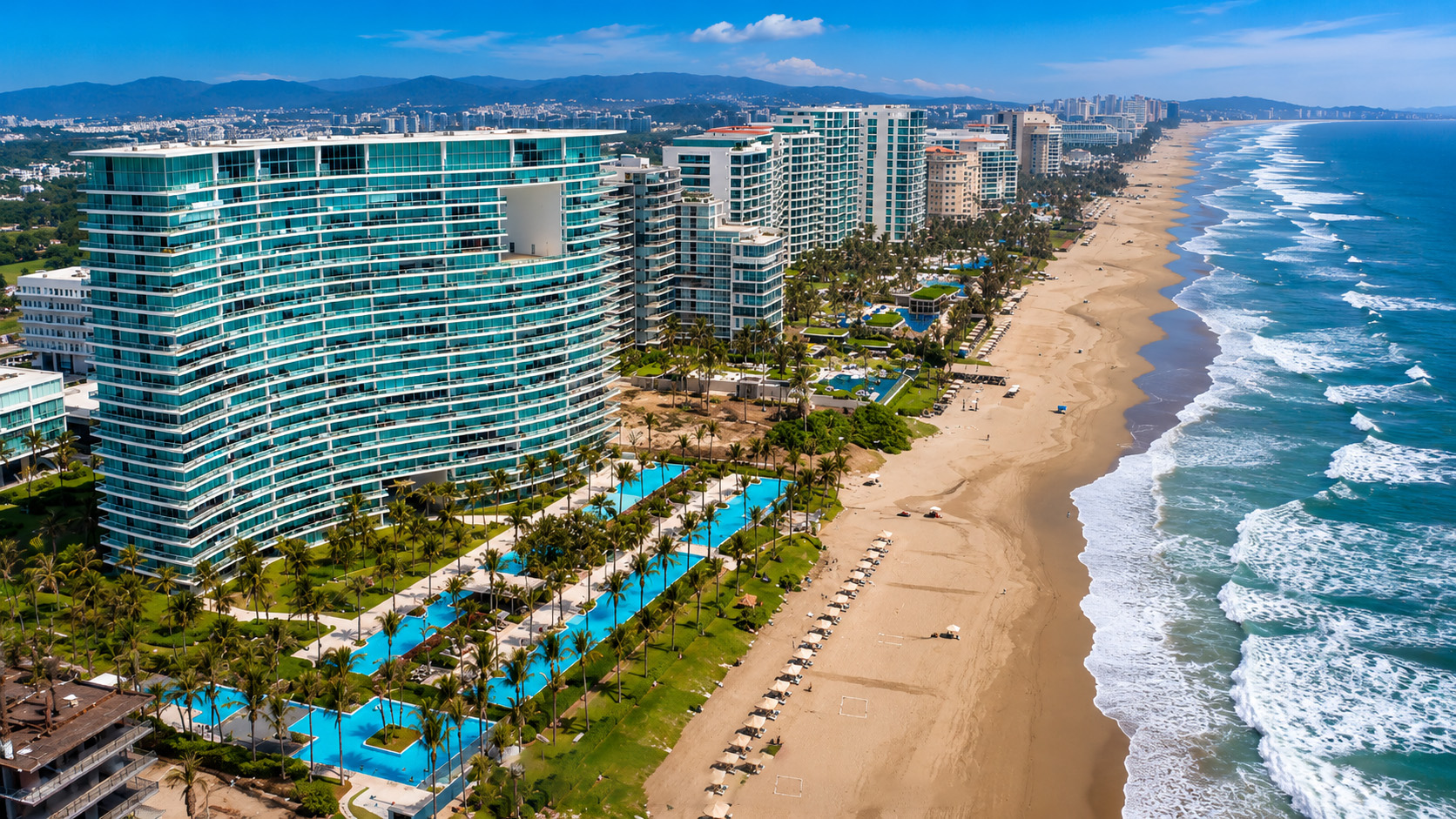 Acapulco’s resort skyline curving around the Pacific Bay