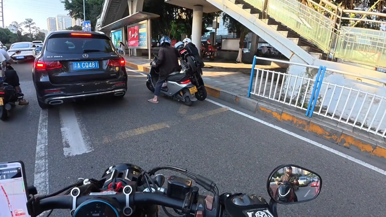 Two e-scooter riders collide while passing through traffic in Chongqing ...