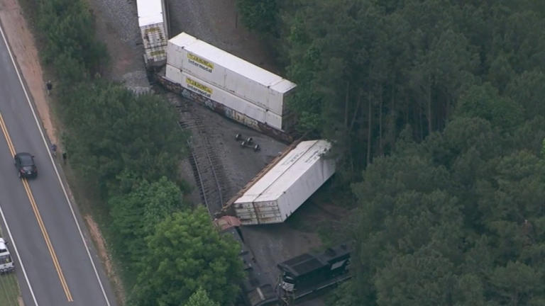 Train derails after crash with tractor-trailer in Hall, crossings closed
