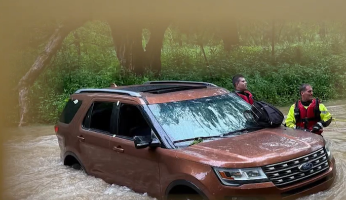 Video captures dramatic rescue after Indiana floodwaters sweep SUV into ...