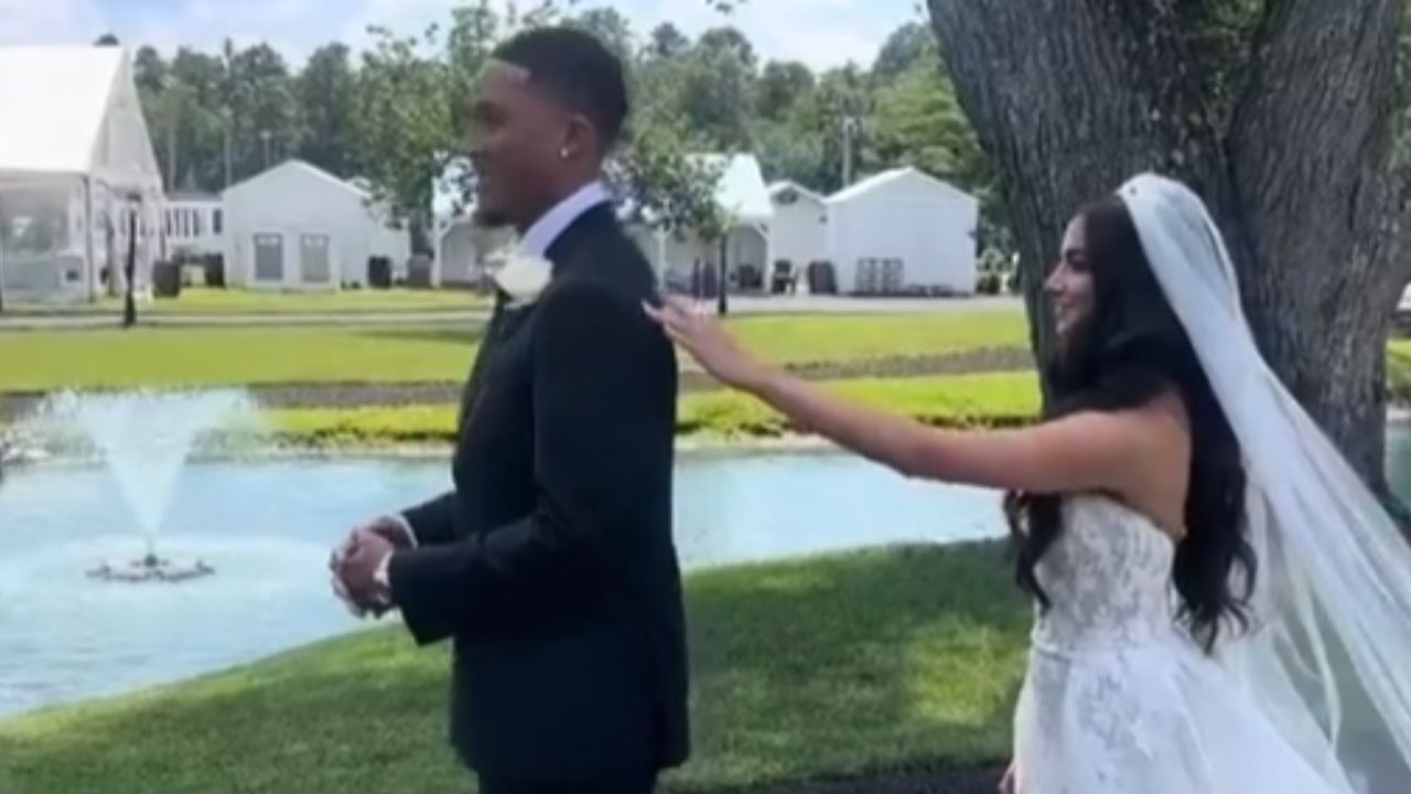 Groom's heart swells with love upon seeing bride in her wedding gown