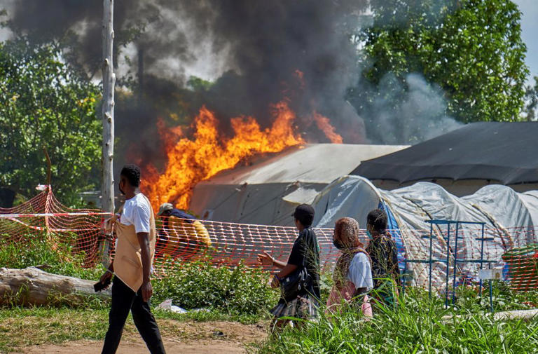 Locals set Ebola clinics on fire and reject aid for 'magic' amid panic ...