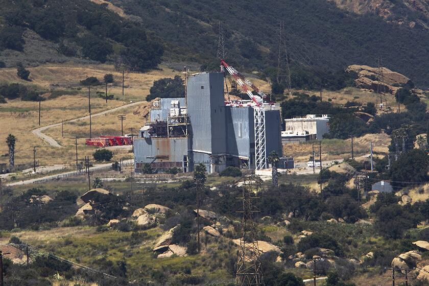 Sandy fire burns near former nuclear test site, triggering air ...
