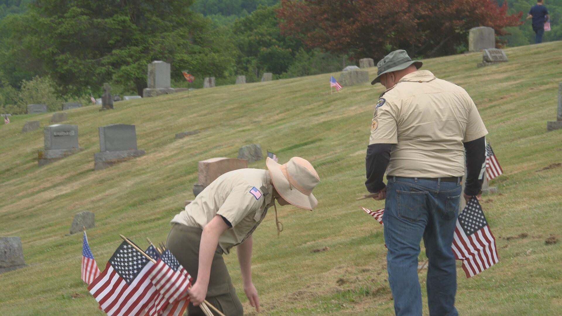Boy Scout troop places flags on veterans’ graves for Memorial Day