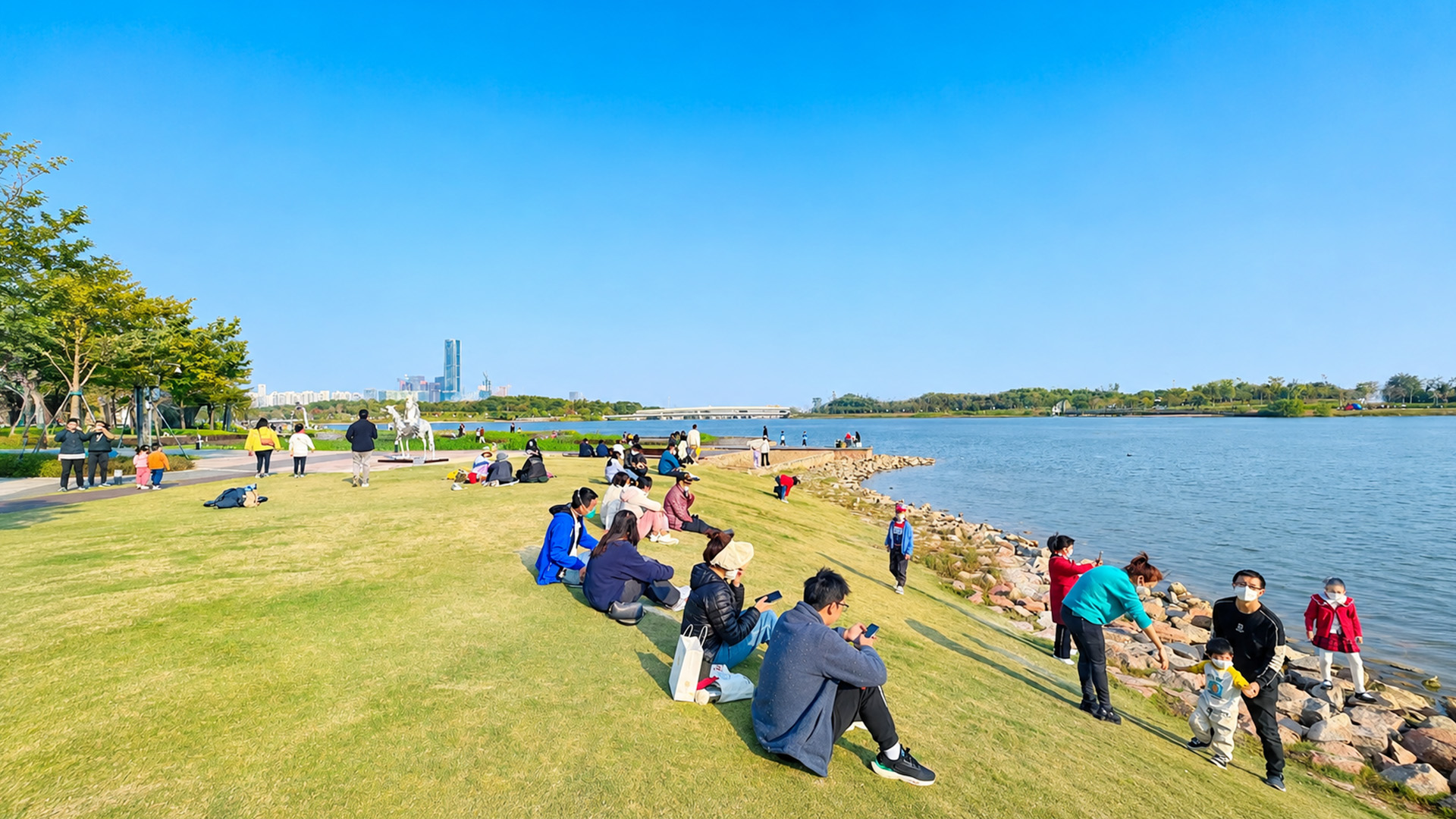 People spend afternoons along Shenzhen’s peaceful waterfront park