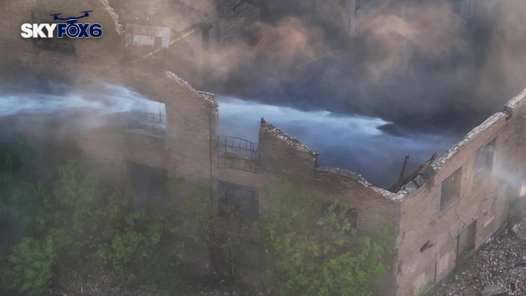 Milwaukee warehouse fire; woman arrested as raze order issued