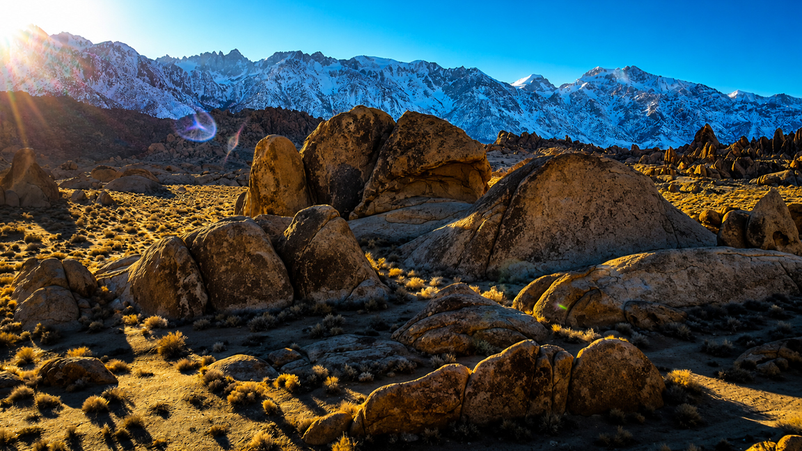 Majestic rocky desert landscape with snowy mountains