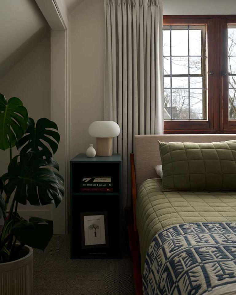 Soft white paint turned a beige 1920s bedroom into a cozy, minimal retreat