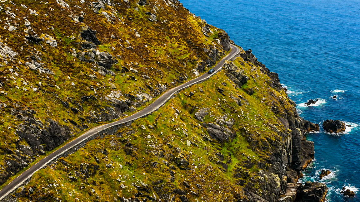 Beautiful coastal highway through rugged rocky hills