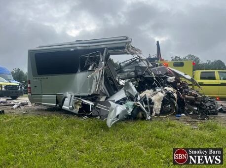 Driver escapes injury after crashing into tractor-trailer carrying ...