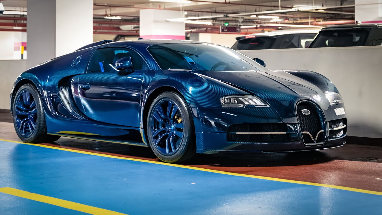 Blue carbon Bugatti Veyron Mansory empire in underground garage