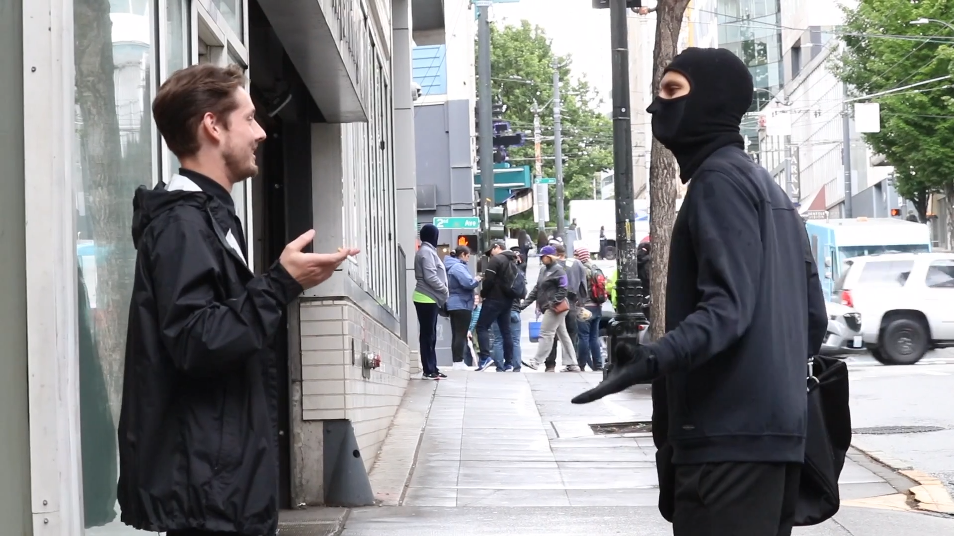 A masked man politely asks for bank directions and strangers freeze