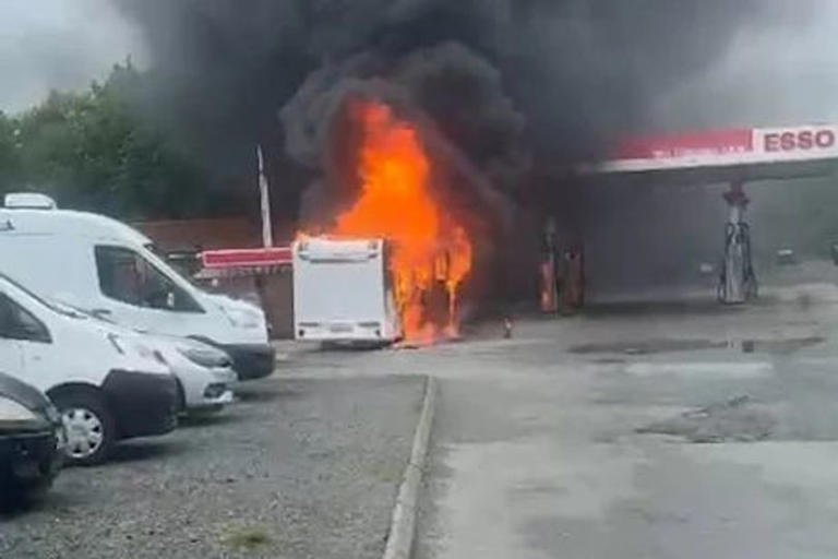 Moment dog pulled from burning campervan at Gwynedd petrol station