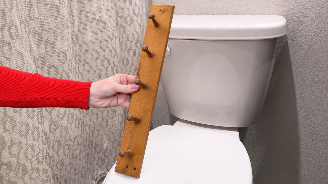 Stick a coat rack beside your toilet - this is brilliant!