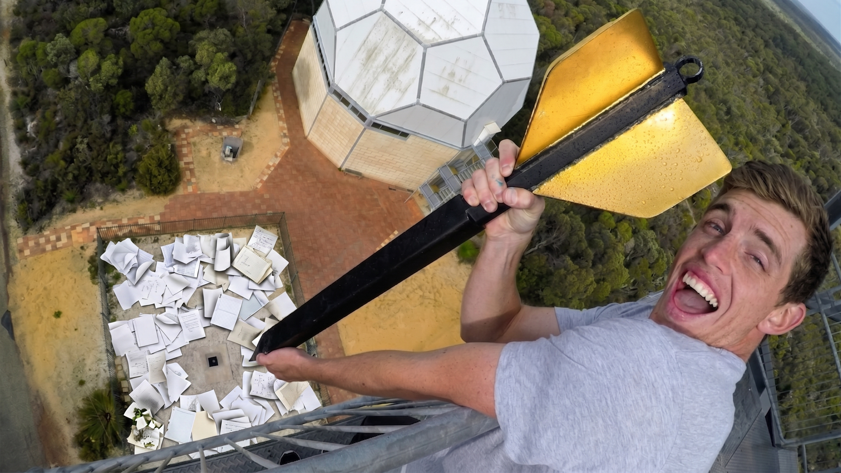 Watch what happens when a giant dart hits 1500 sheets of paper from 150 ft