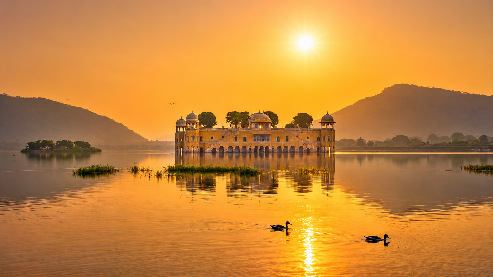 Jal Mahal glowing like a floating palace at sunrise