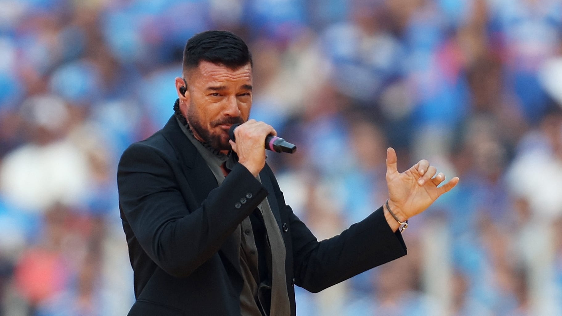 Ricky Martin flees after fan sprays tear gas at stage