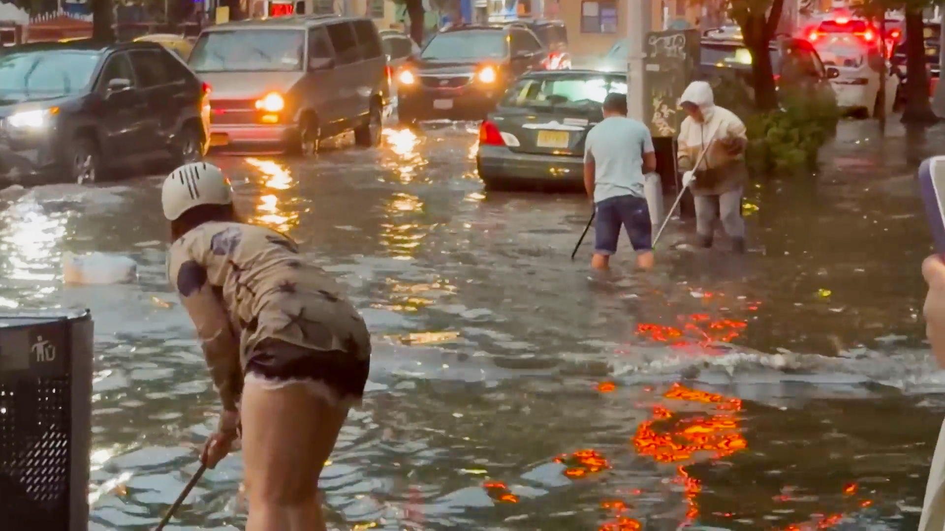 Storms flood New York streets, topple trees