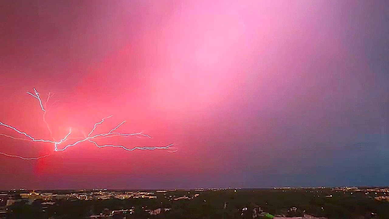 Lightning, double rainbow and sunset collide over Texas sky