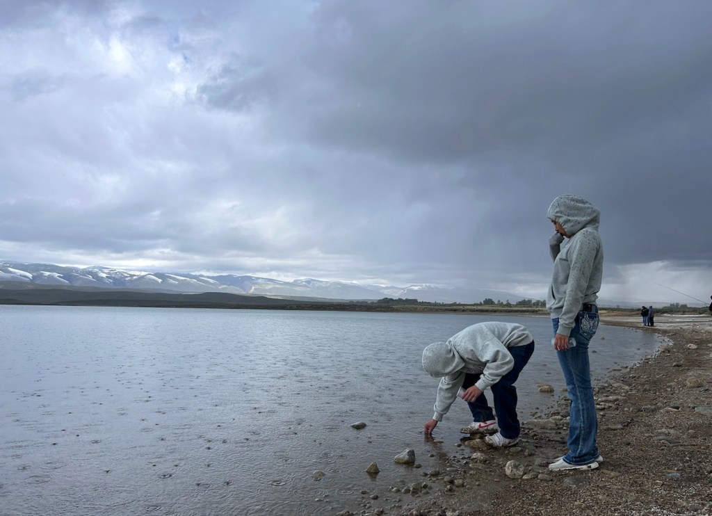 Tribal students in central Wyoming release small fish in a big pond