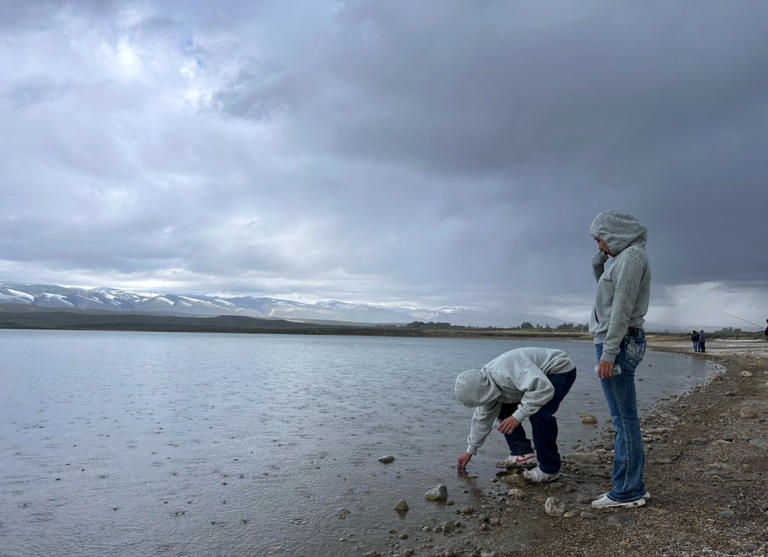 Tribal students in central Wyoming release small fish in a big pond