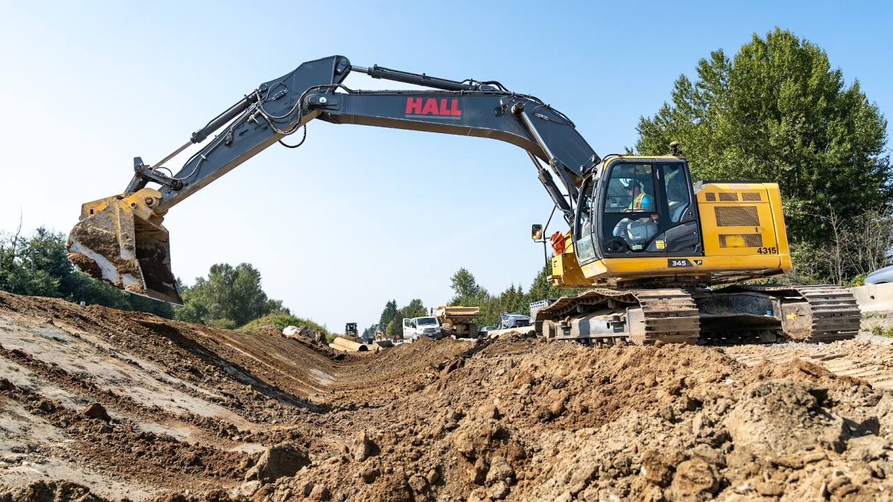 Large hydraulic excavator working on earthmoving project