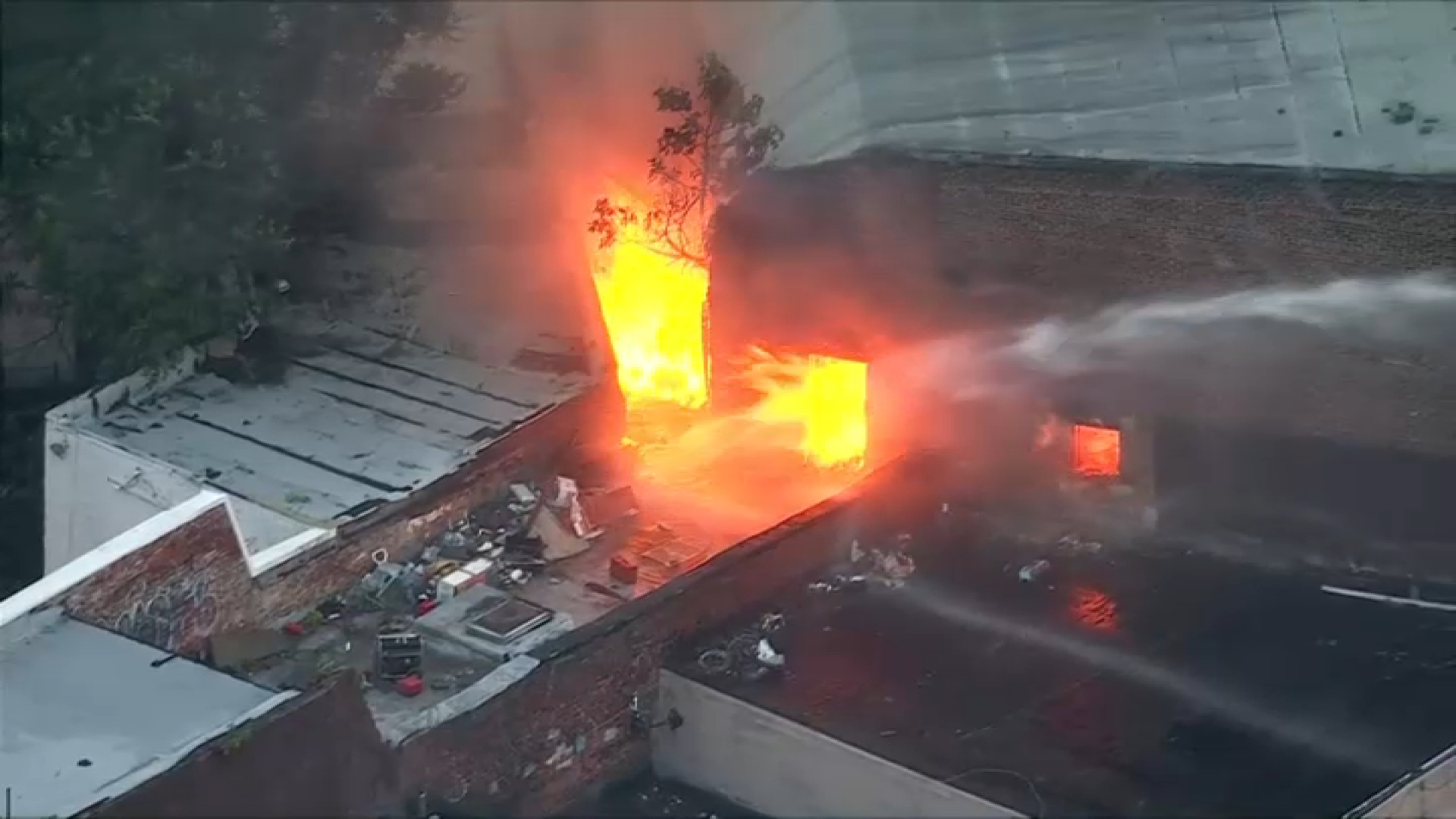 Watch: Fire crews battle flames at Kensington garage