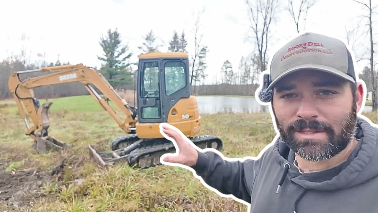 Knocking down dead trees with mini excavator