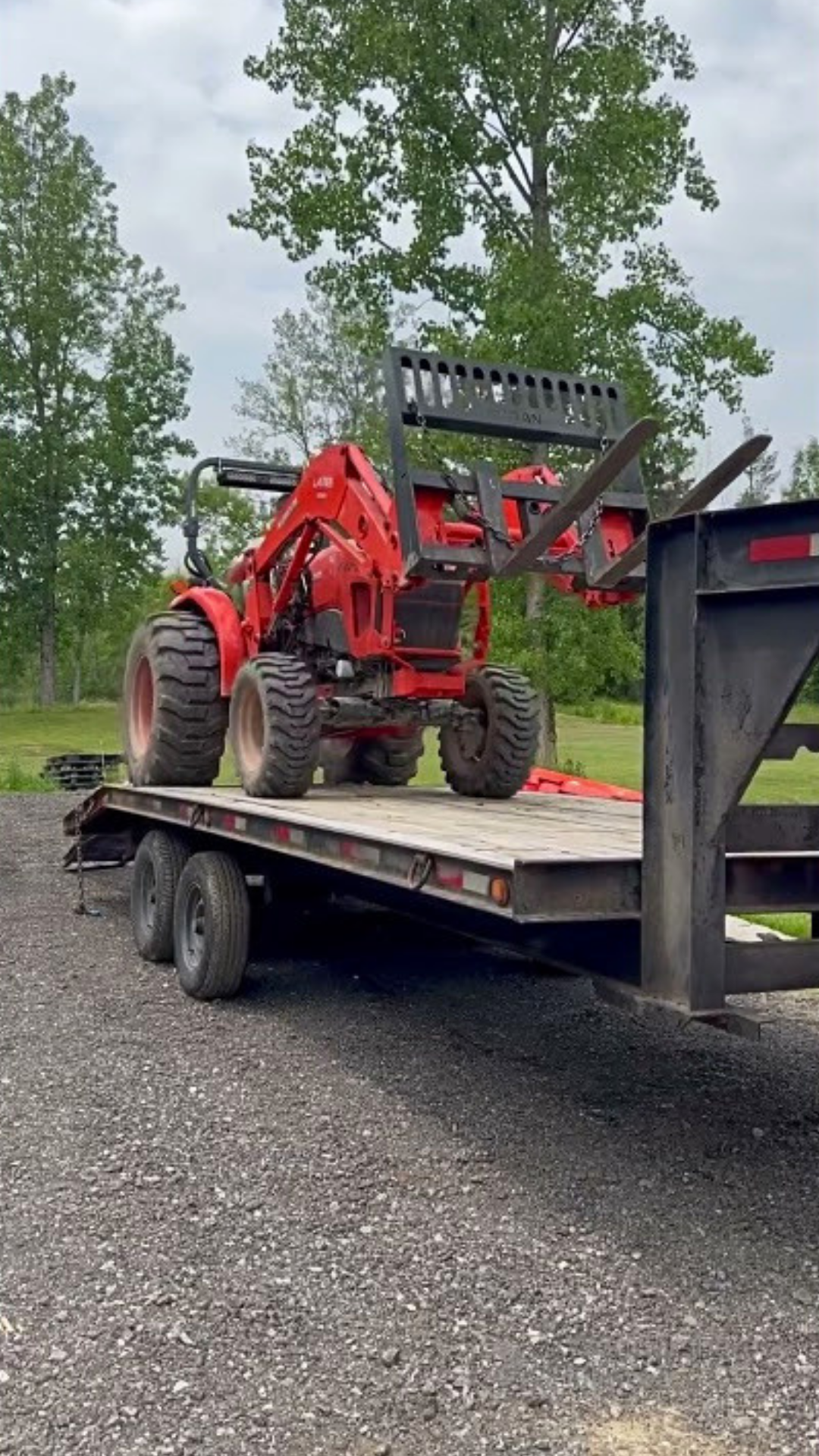 Loading the tractor on a gooseneck trailer