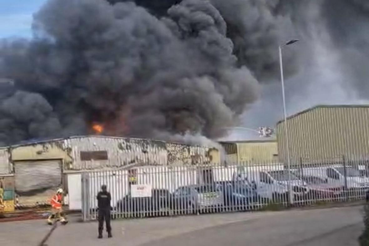 Major fire from Wigan commercial building unleashing black billowing ...