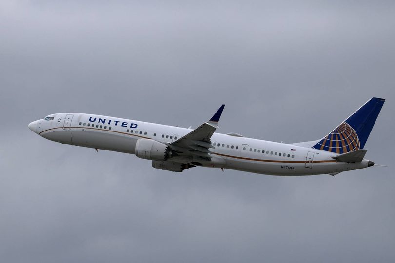 United Airlines flight in mid-air emergency as passenger tries to open door