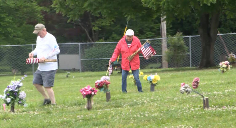Volunteers plant American flags at veteran gravesites ahead of Memorial Day