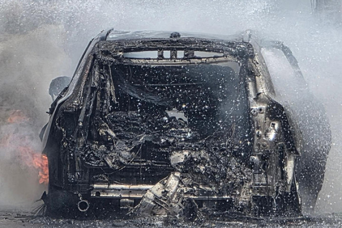 Volvo bursts into flames, passengers escape safely