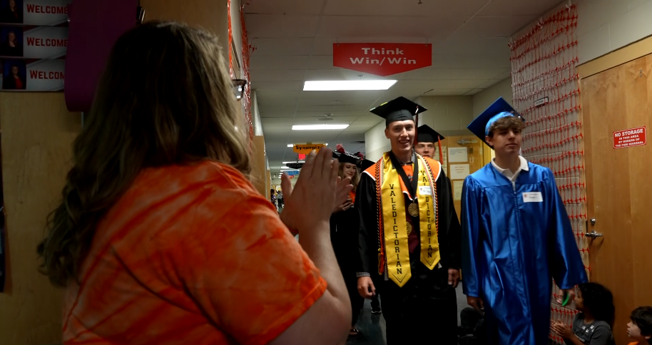Graduating high school seniors return to Dan Mills Elementary School ...