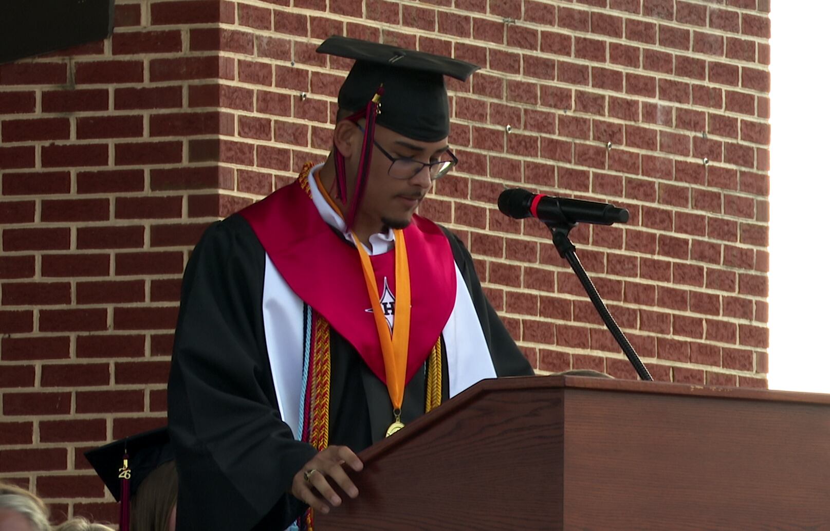 Harlem High School seniors graduate at Evans Towne Center Park