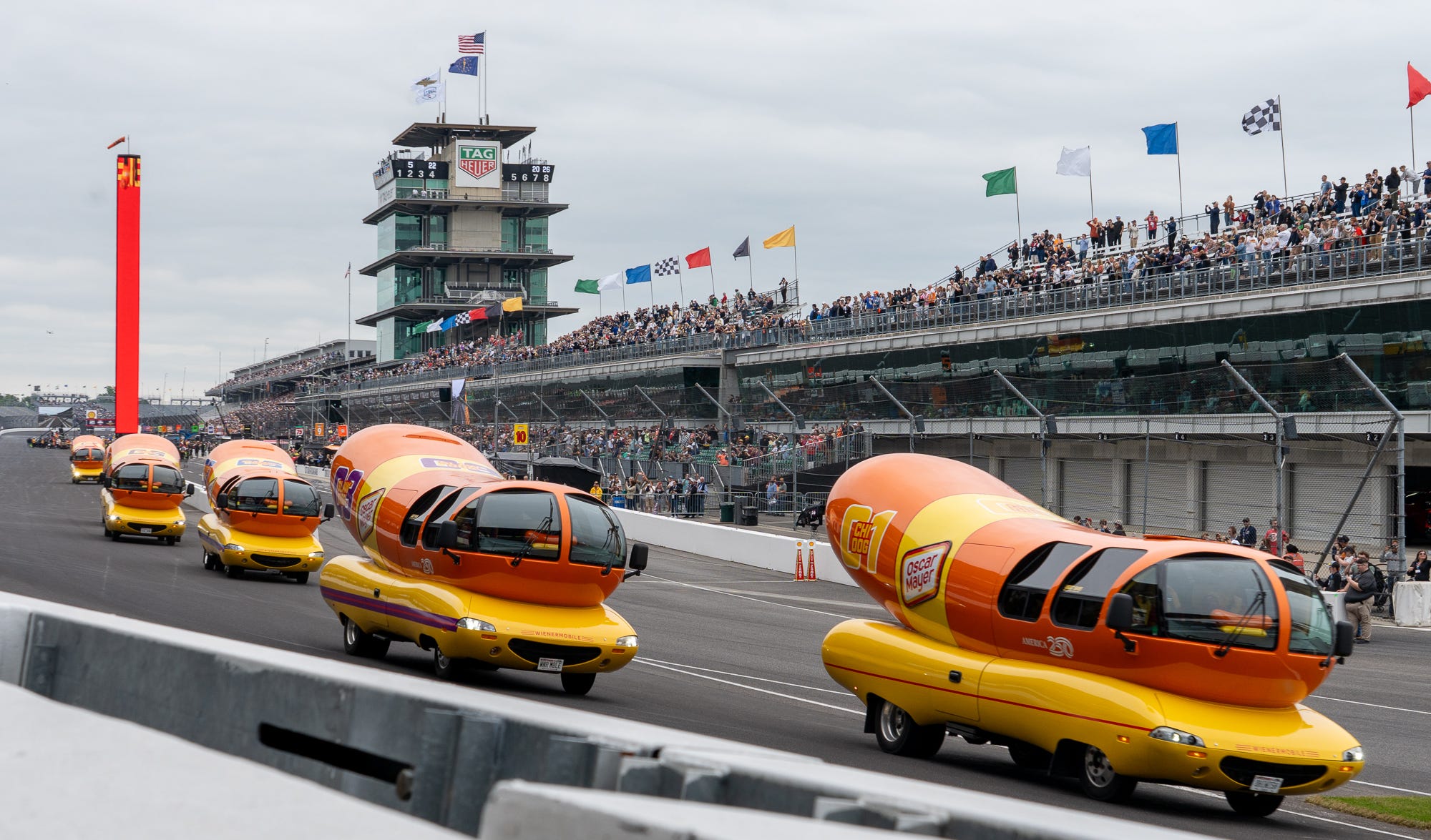 Relish these photos of Oscar Mayer Wienermobiles on the Indy 500 track ...