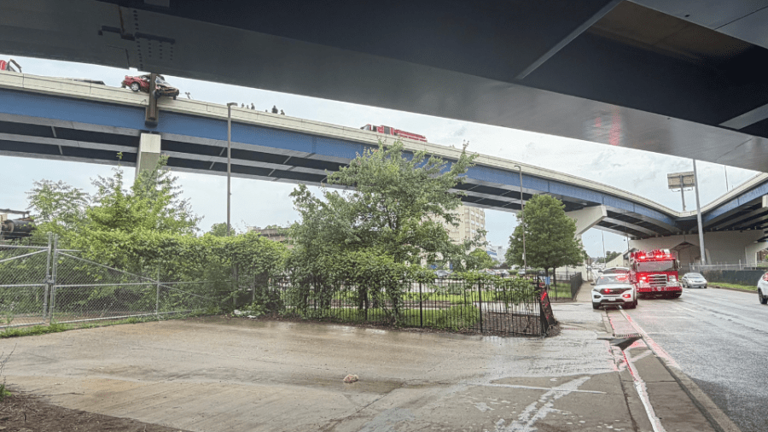 Police: Driver 'fine' after crash sends car hanging off side of ...