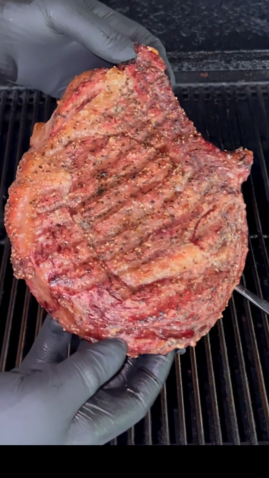 Guy grills a garlic butter steak
