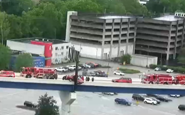 Police: Driver 'fine' after crash sends car hanging off side of ...