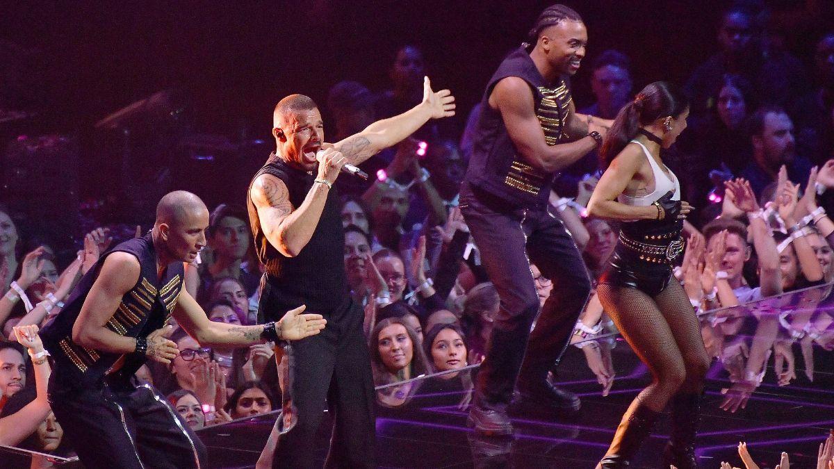 Chaos erupts at Ricky Martin concert as singer is rushed off stage mid ...